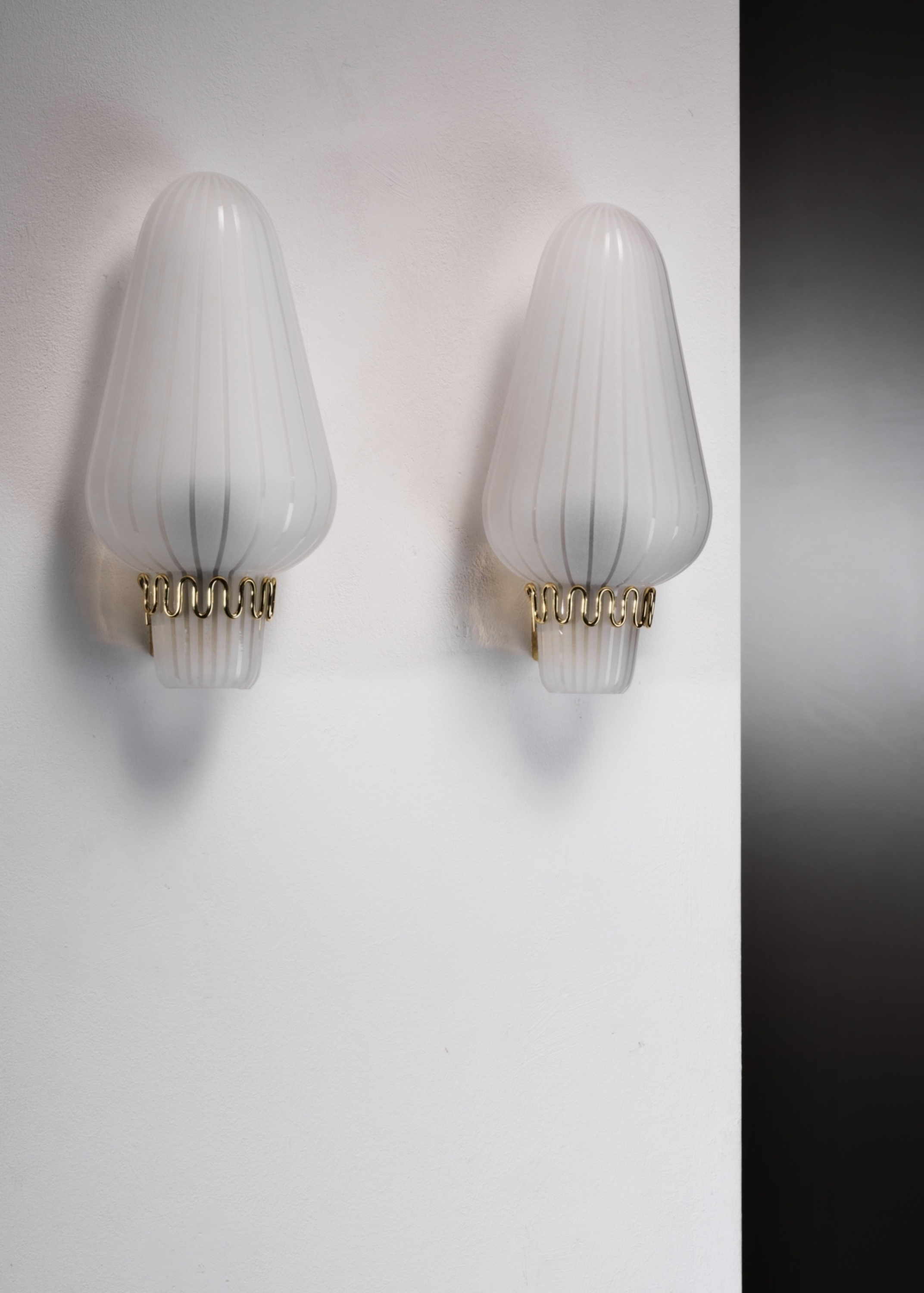 Pair of Harald Notini wall lamps for Böhlmarks | Bloomberry